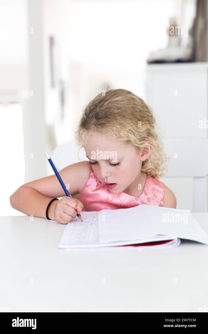 Girl doing her homework Stock Photo - Alamy