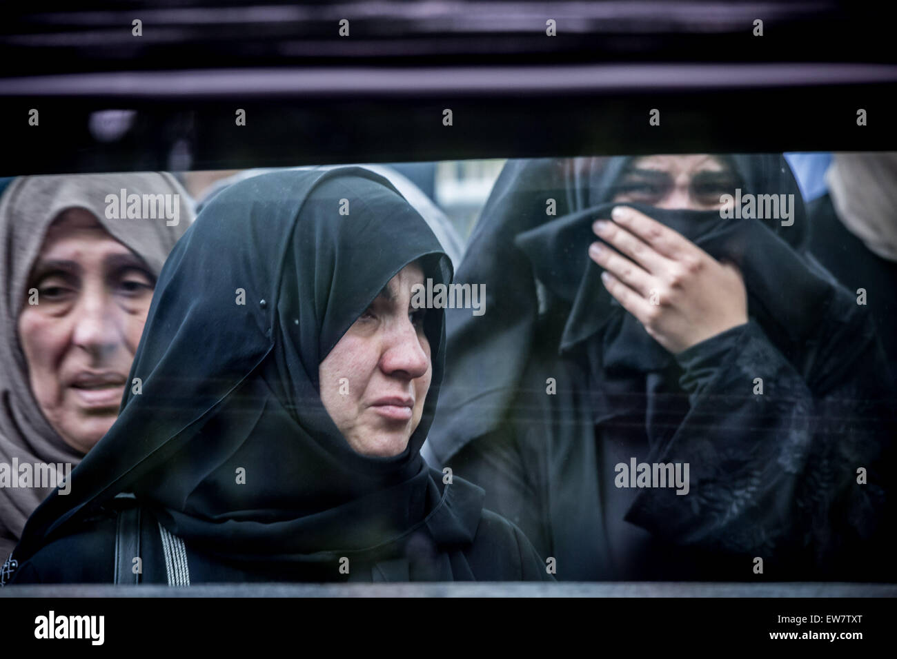 London, UK. 19th June, 2015. Muslim women mourn by a coffin carrying ...
