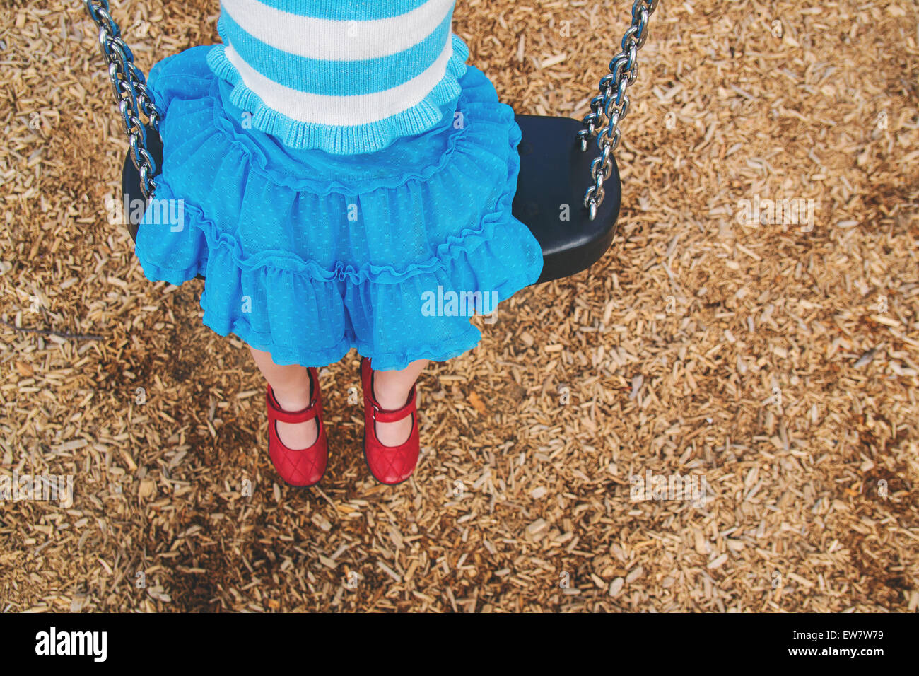 Overhead view of a girl sitting on a swing Stock Photo - Alamy