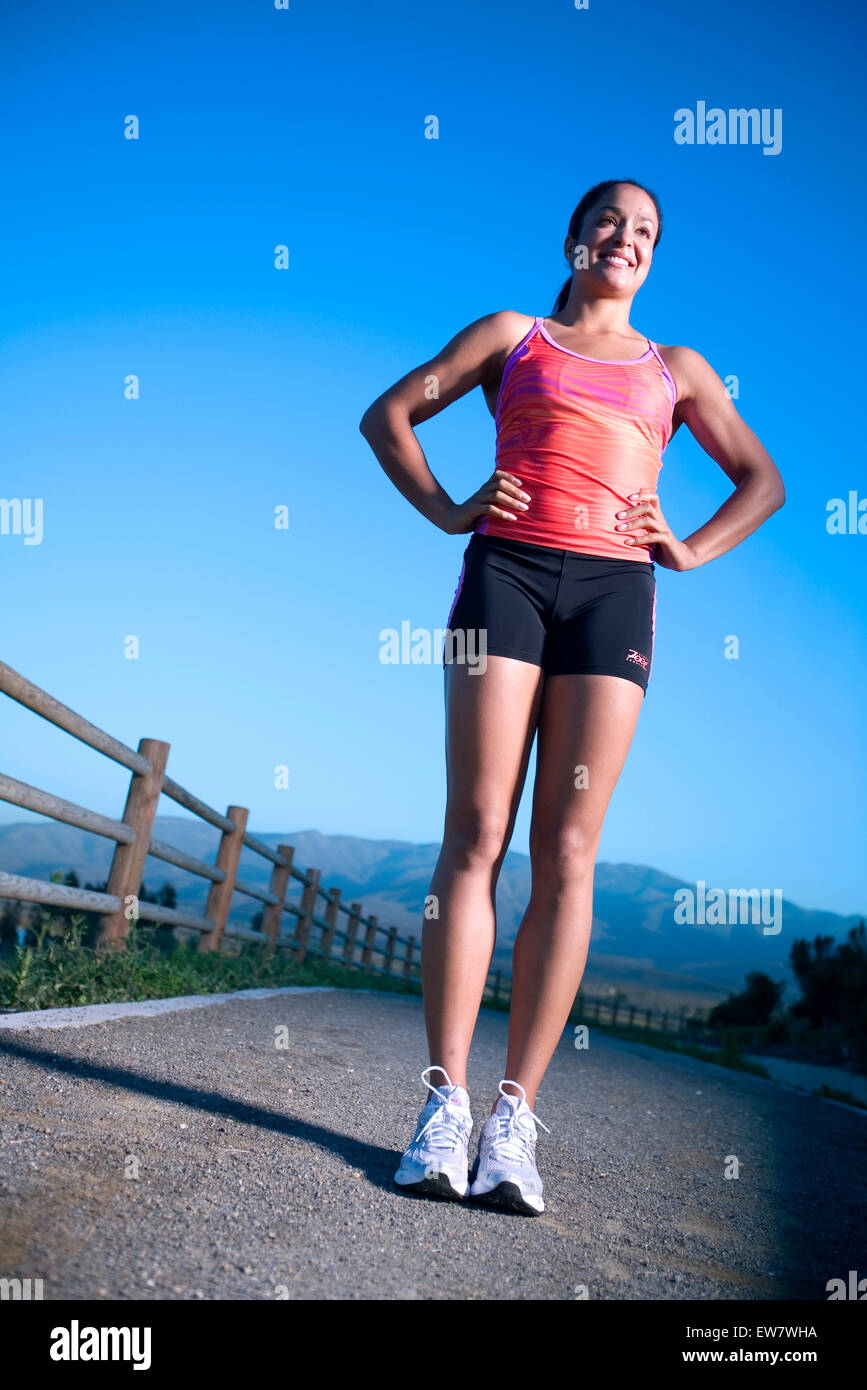Attractive female runner posing for a portrait Stock Photo - Alamy