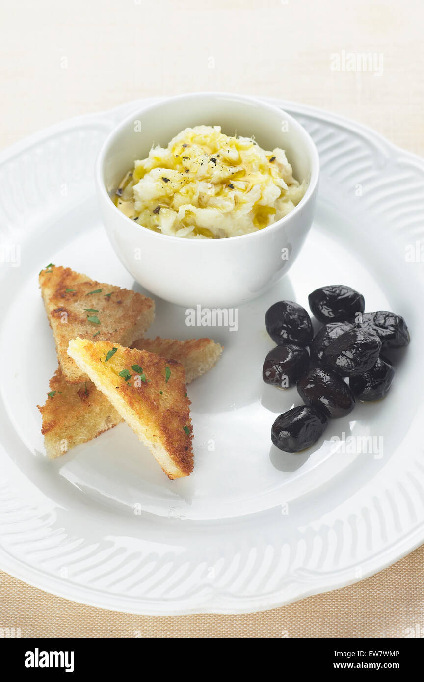 Olives, coleslaw and bread tapas dish Stock Photo - Alamy