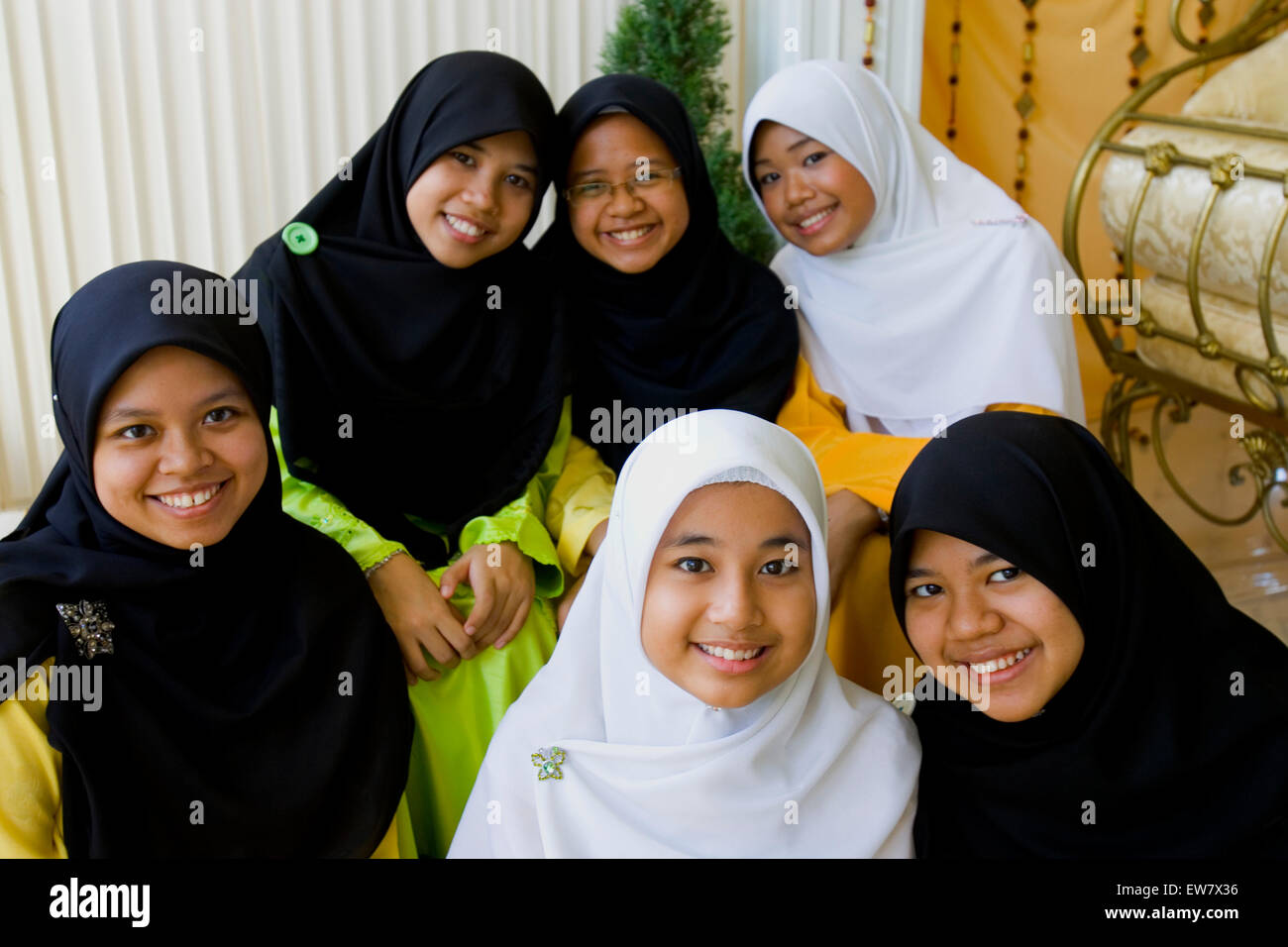 Muslim women pose for a photograph at a wedding in Singapore Stock ...