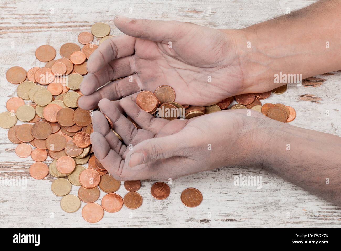 a poor hands taking some coins Stock Photo - Alamy