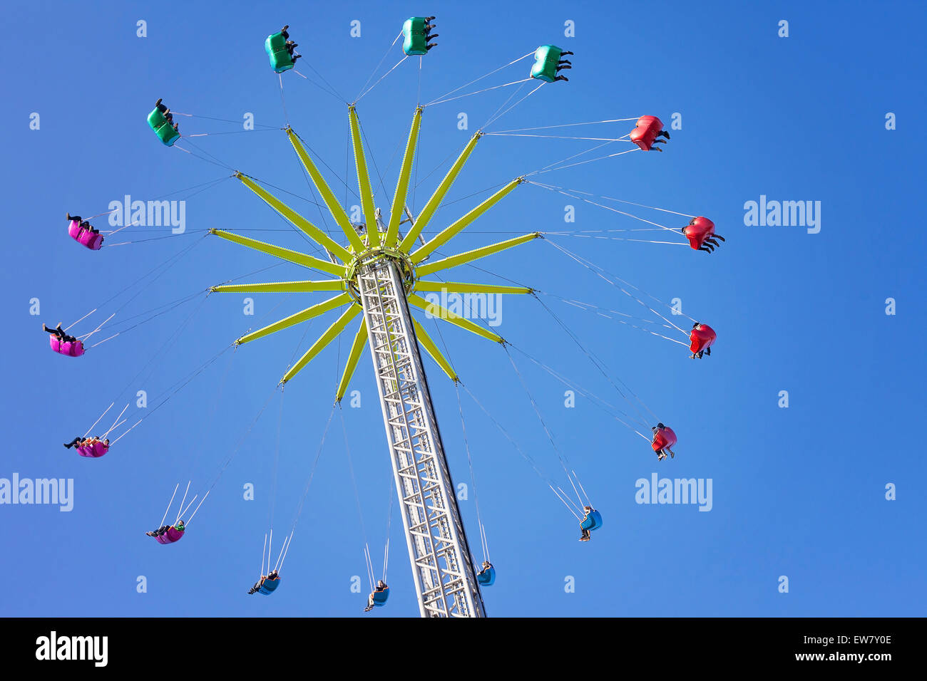 Merry-go-round, chain swing carousel ride in amusement park, shot from ...