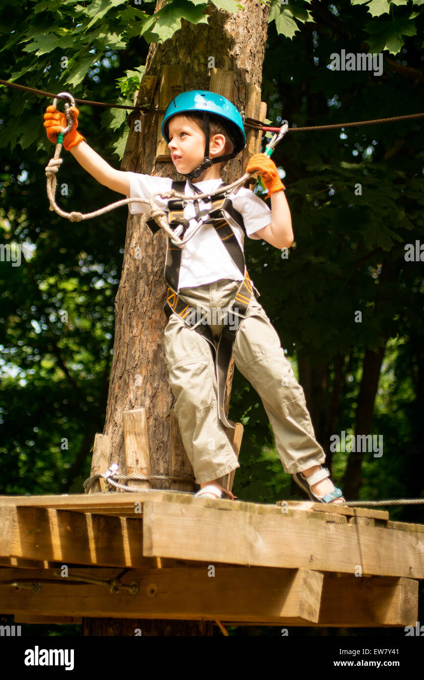 Five year boy on rope-way in forest Stock Photo - Alamy