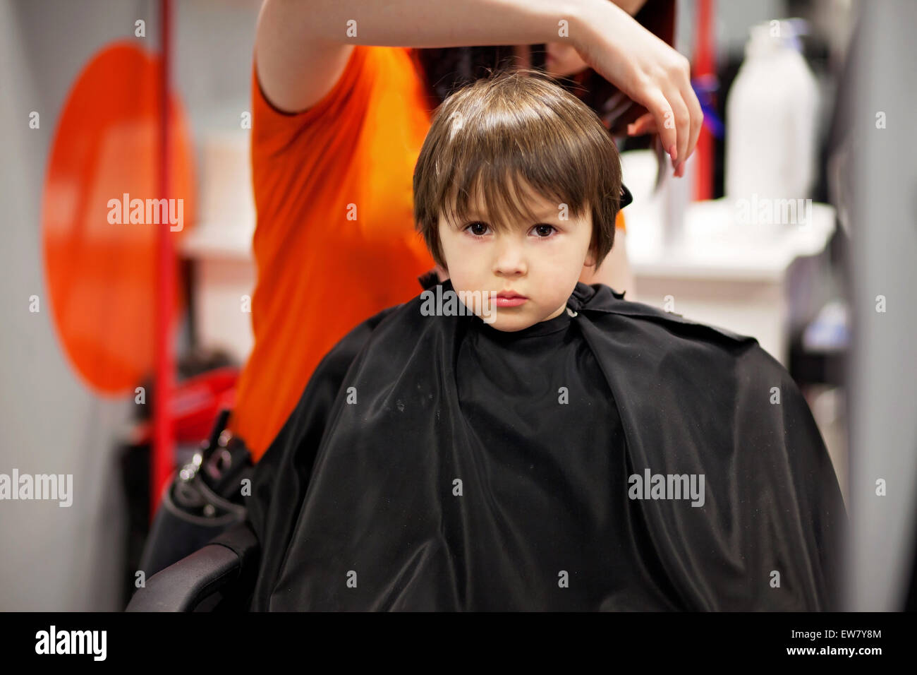 Cute little boy, having haircut in barber shop Stock Photo - Alamy