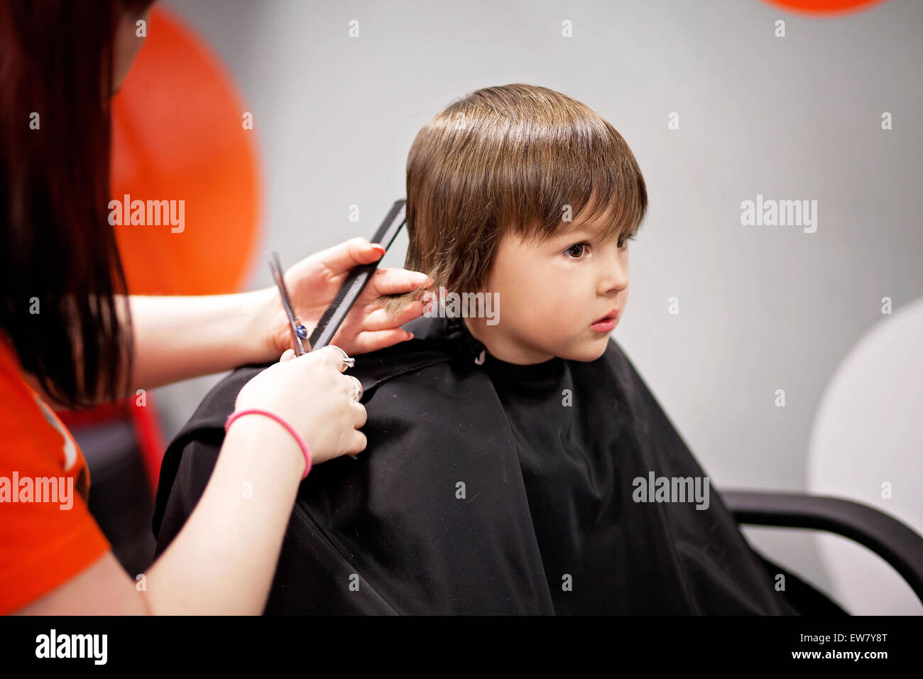 Cute little boy, having haircut in barber shop Stock Photo - Alamy