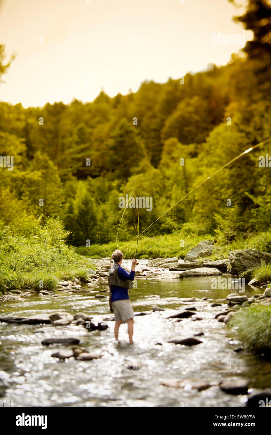 Summer fly fishing in the Vermont sun Stock Photo - Alamy