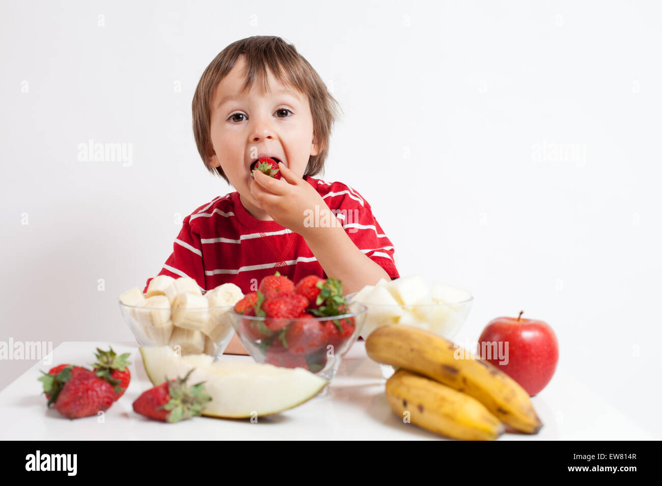 Cute Toddlers Eating Fruit
