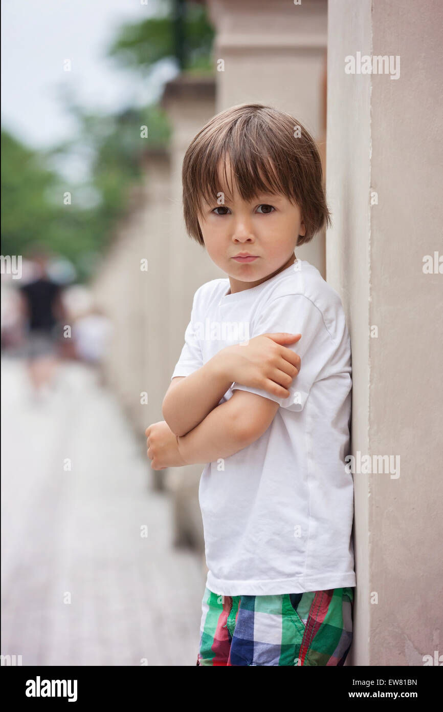Portrait of a little angry boy, outdoors, boy expressing his emotions ...