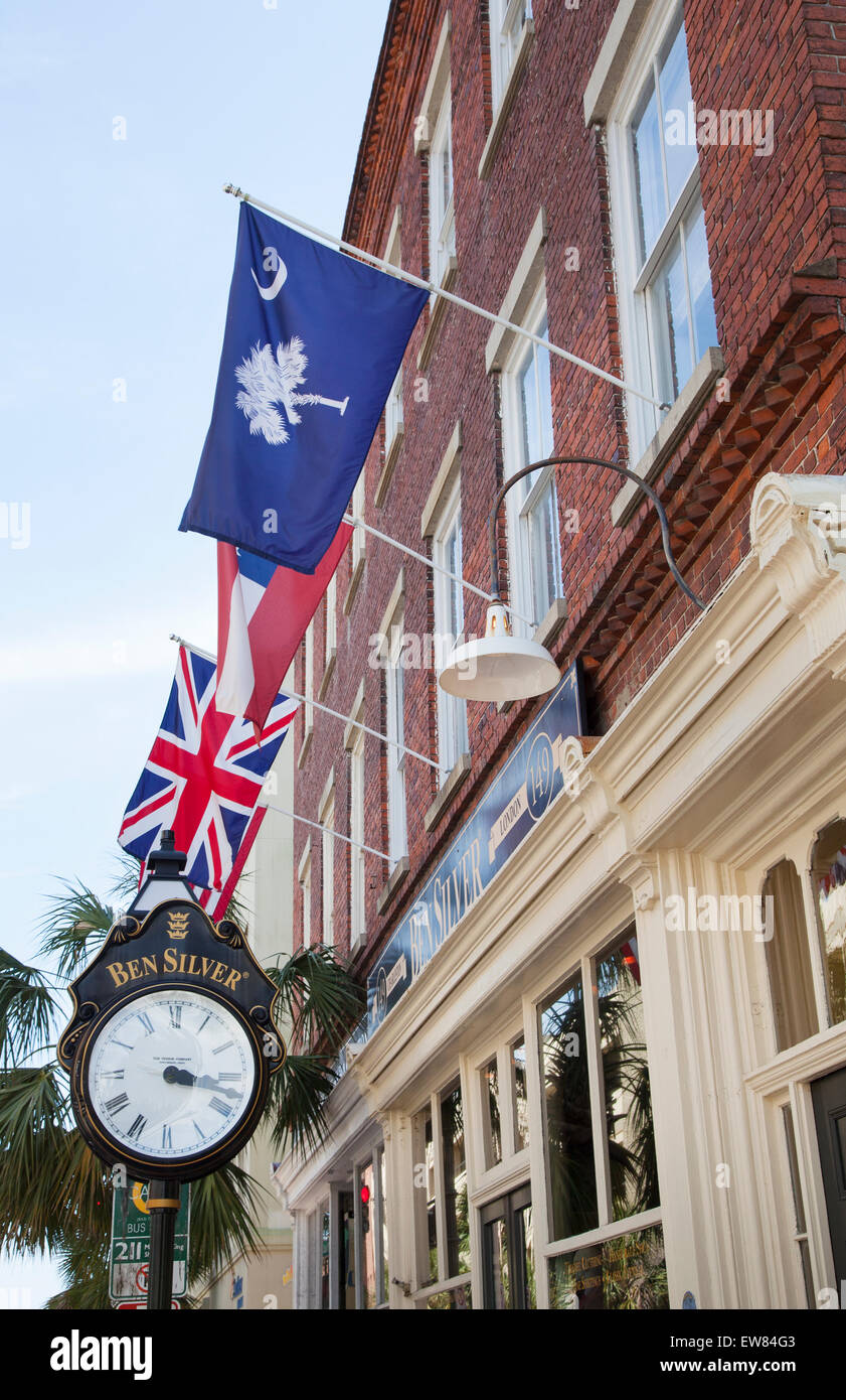 Charleston, South Carolina USA Flags blowing on side of brick building ...