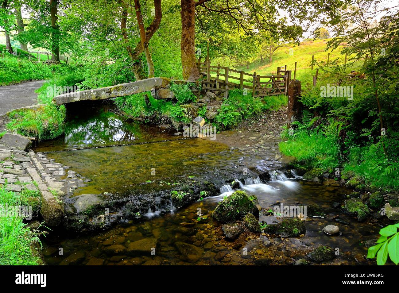 Old Historic Footbridge and Ford across the stream Stock Photo - Alamy