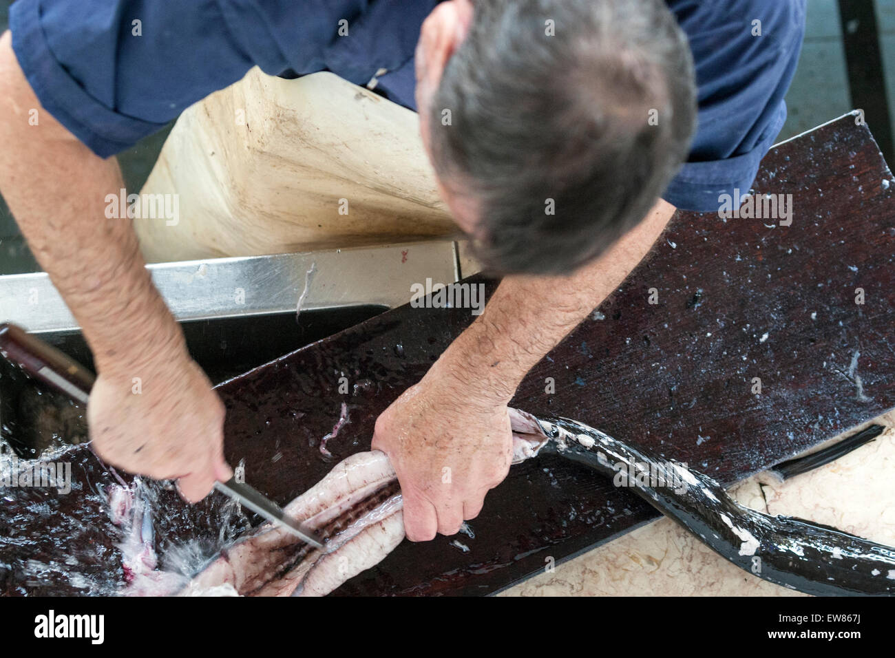 A Fishmonger At The Fish Market At Funchal High Resolution Stock ...