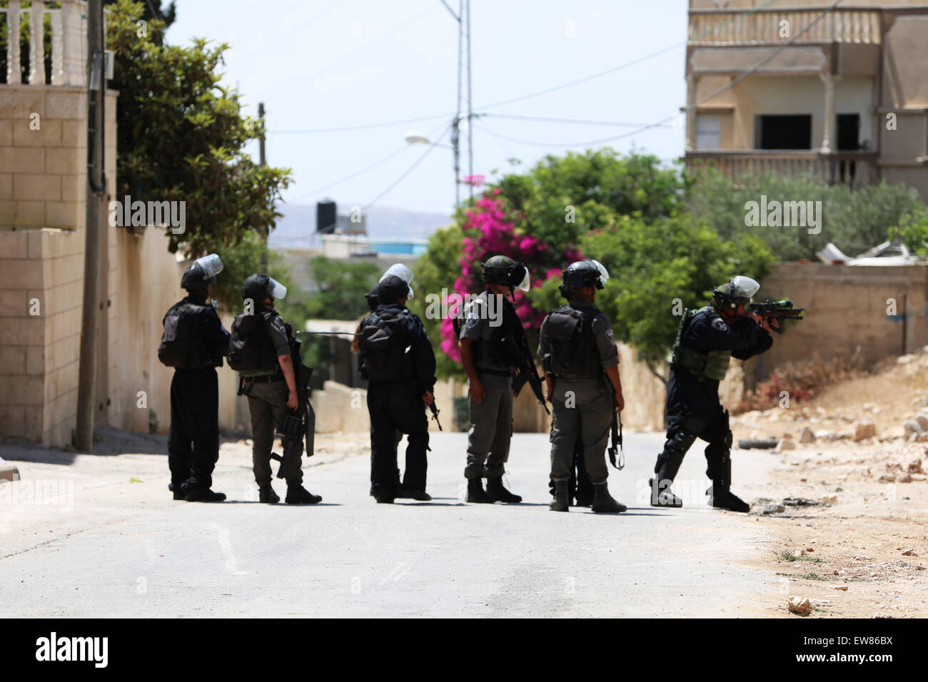 An Israeli sniper aims his rifle inside the Palestinian village of Kafr ...