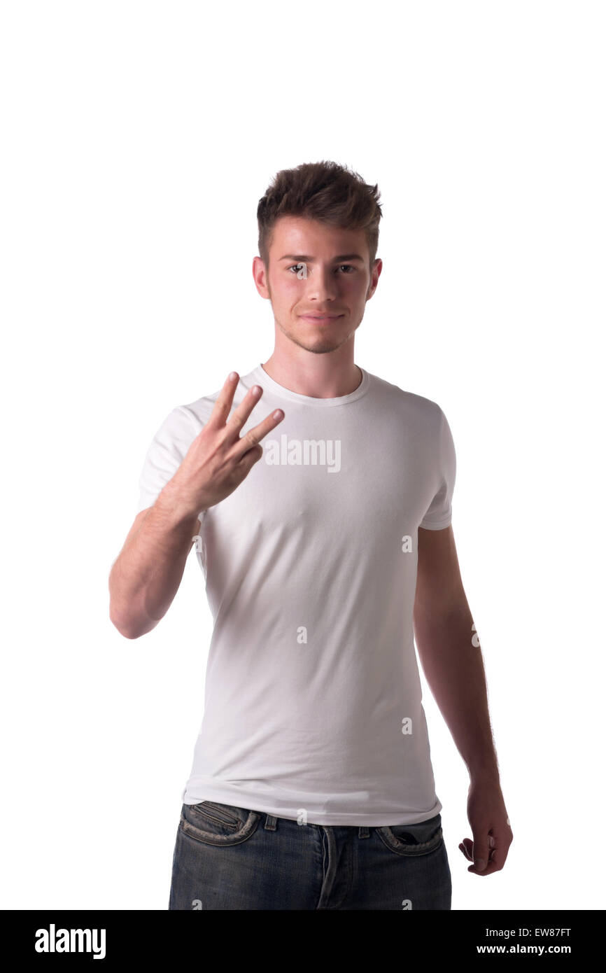 Attractive young man counting to three 3 with fingers and hands ...