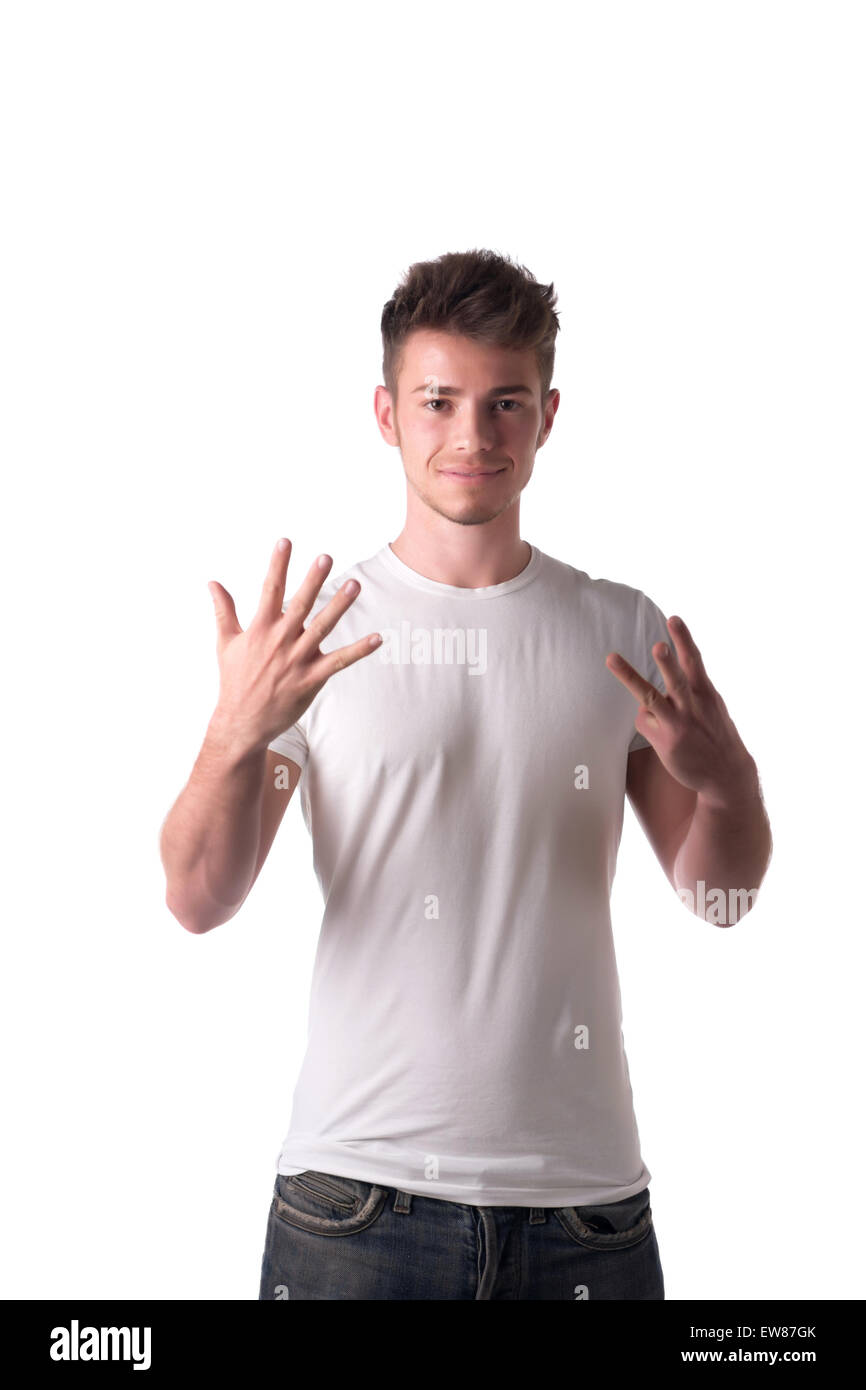 Attractive young man counting to eight 8 with fingers and hands ...
