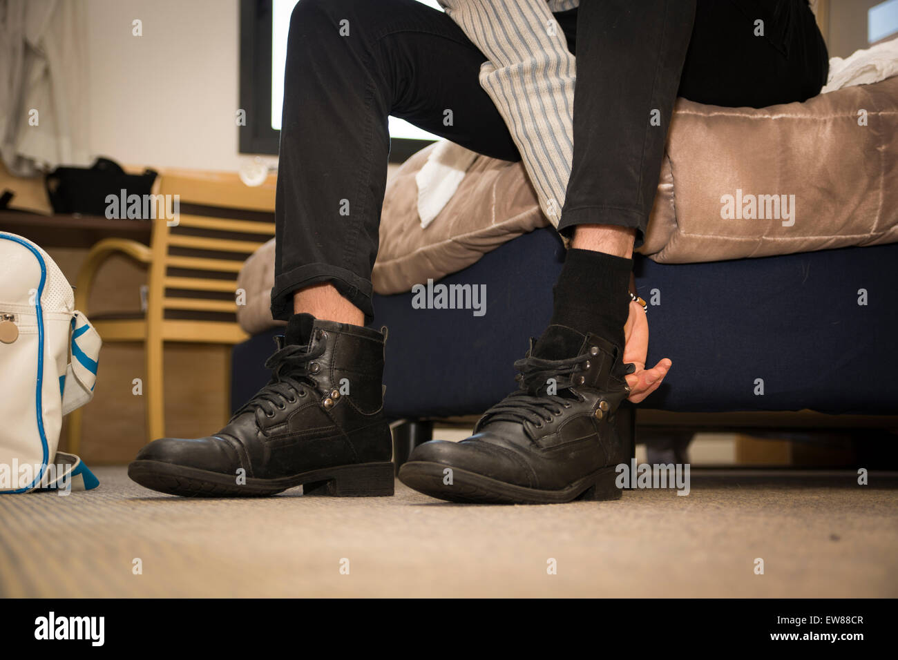 Businessman putting on shoes hi-res stock photography and images - Alamy