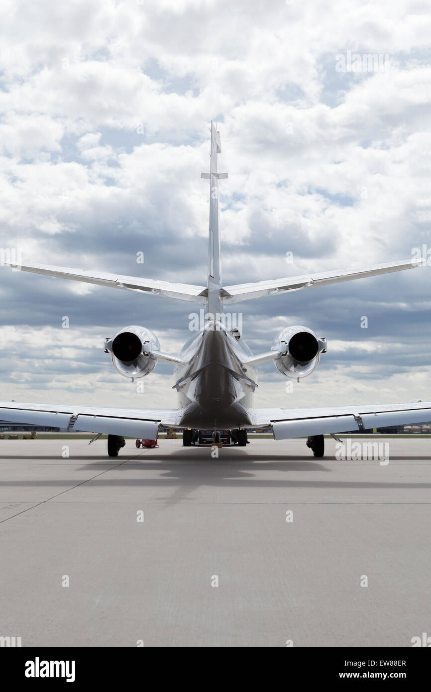 Aircraft learjet Plane in front of the Airport with cloudy sky and sun ...