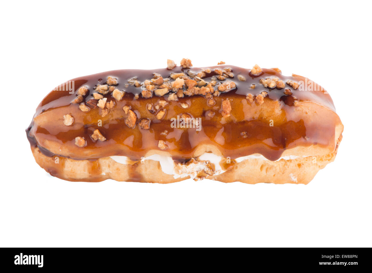 Eclair with caramel decoration on white reflective background Stock ...