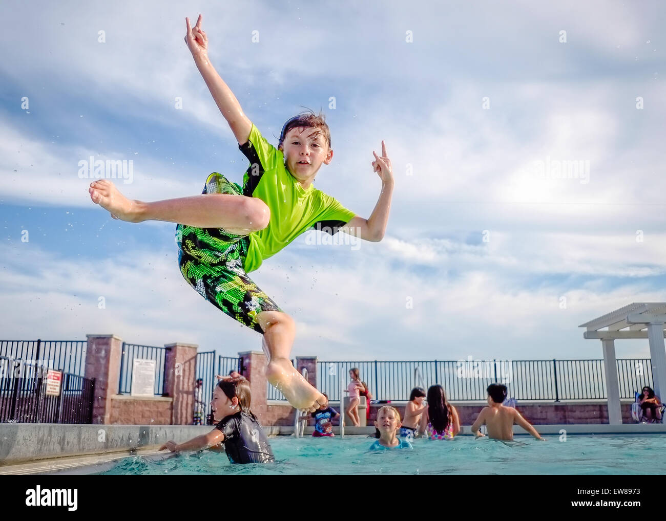 Young boy jumping into the pool.Hewlett Point Park ,East Rockaway NY ...