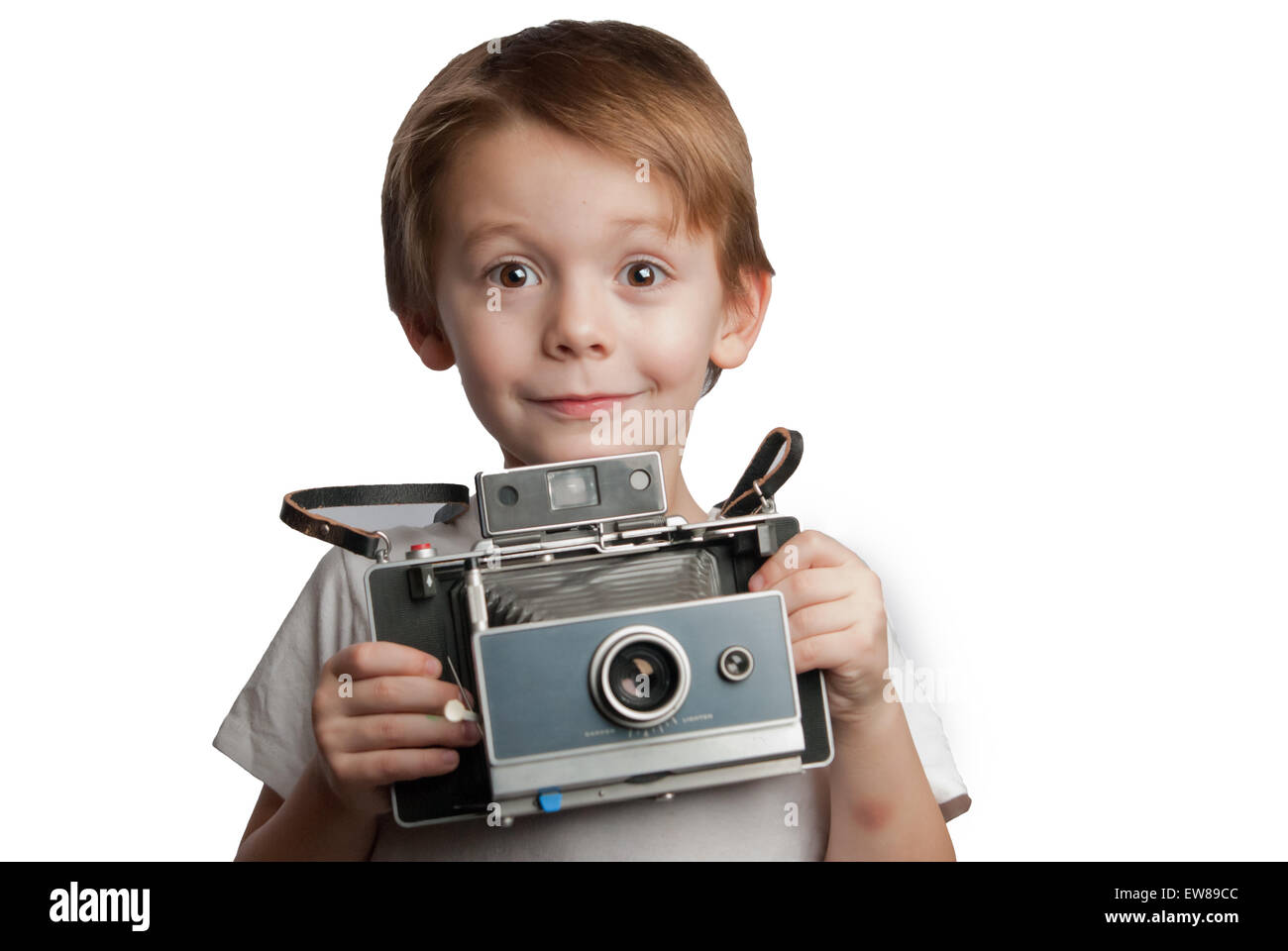young child holding a instant camera on a white background Stock Photo ...