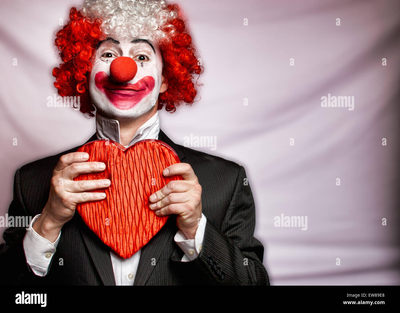 colorful clown with a box of candy on a white background Stock Photo ...