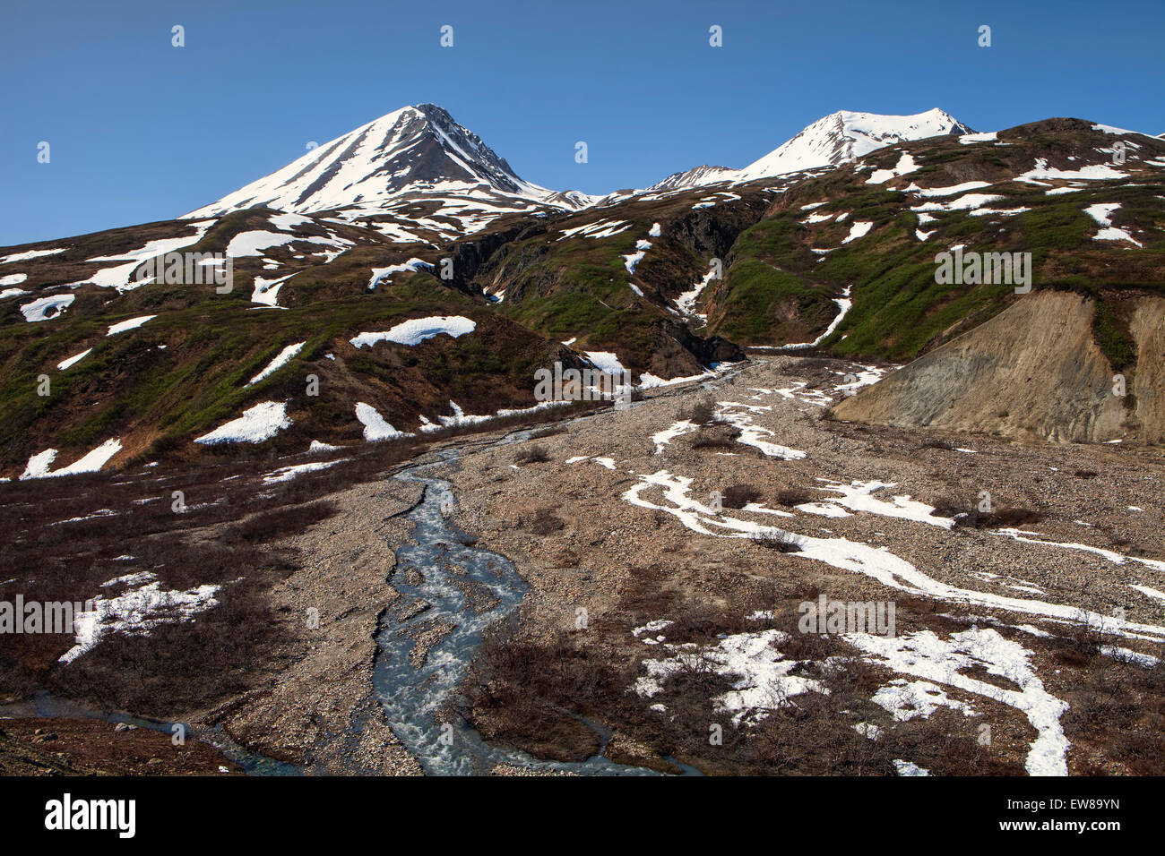 Water flowing off mountains from glacial melt and melting snow in spring in high elevations in ...