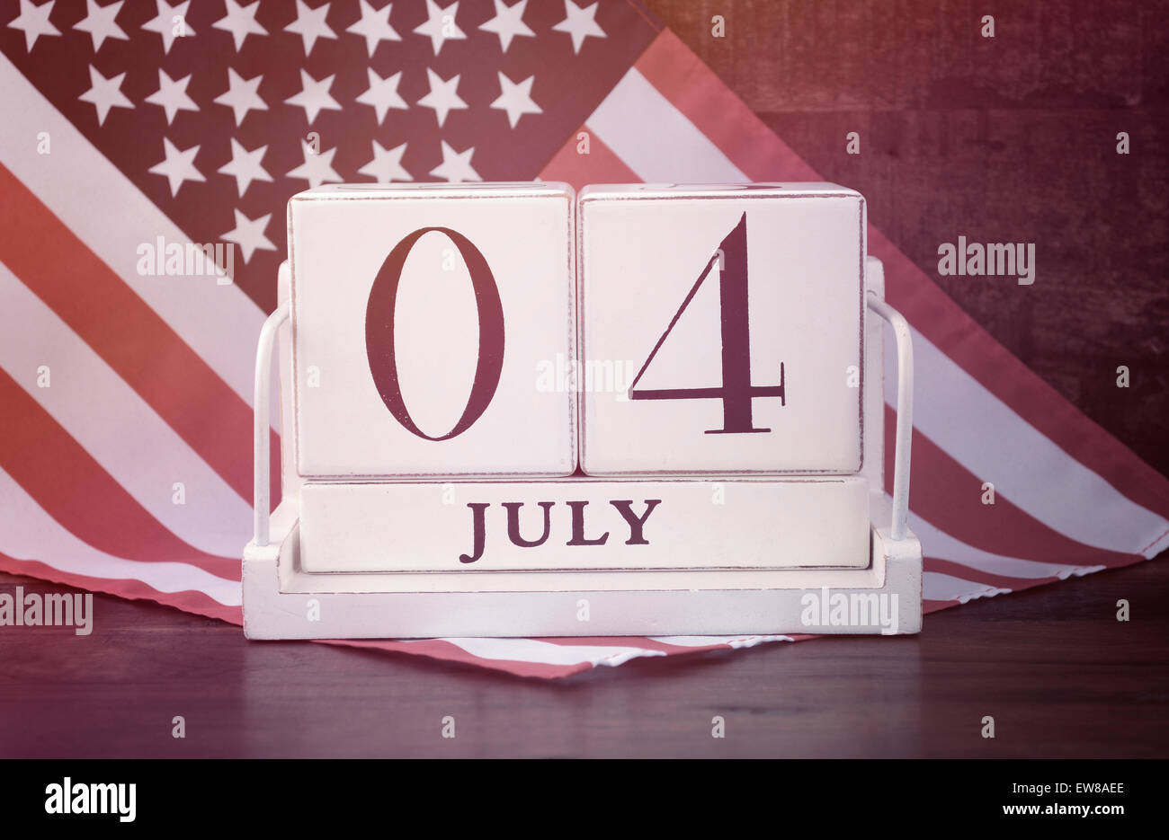 Fourth of July vintage wood calendar with flag on dark wood rustic ...