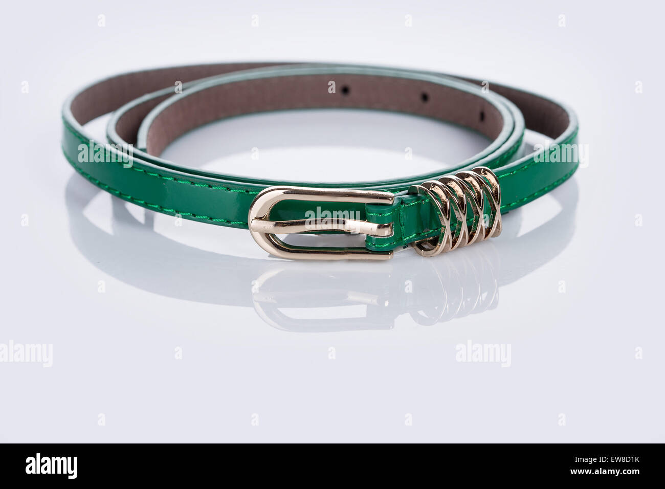 thin green female belt buckle with fine Stock Photo - Alamy