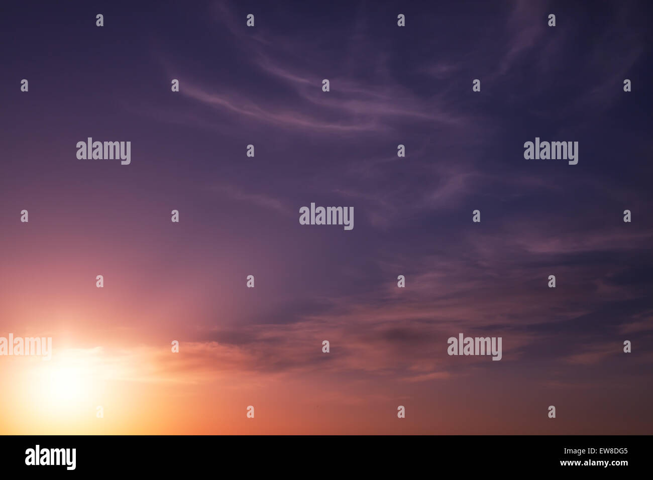 Summer sunset sky with clouds and sun Stock Photo - Alamy
