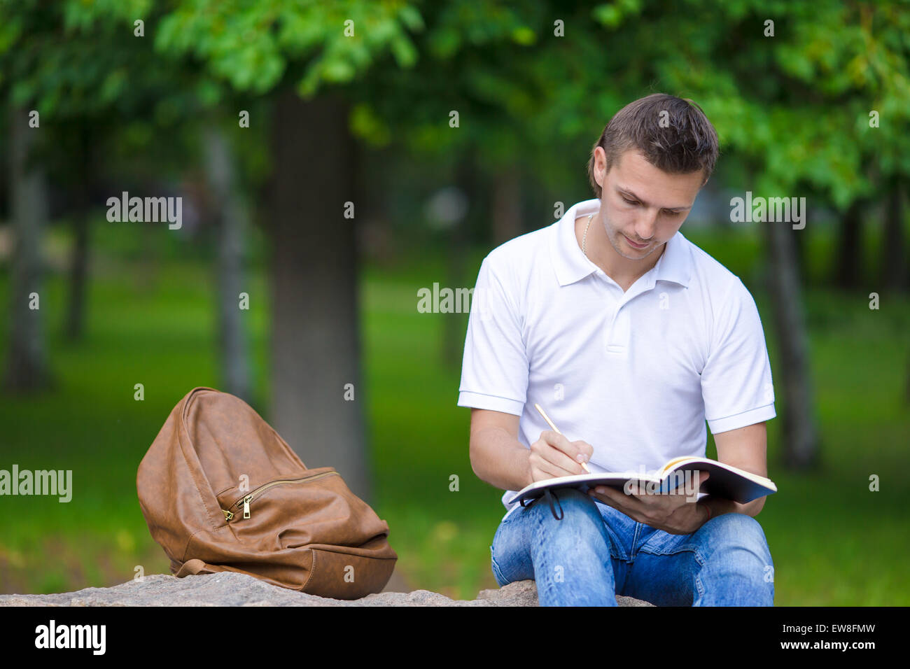 Man write book outdoor hi-res stock photography and images - Alamy