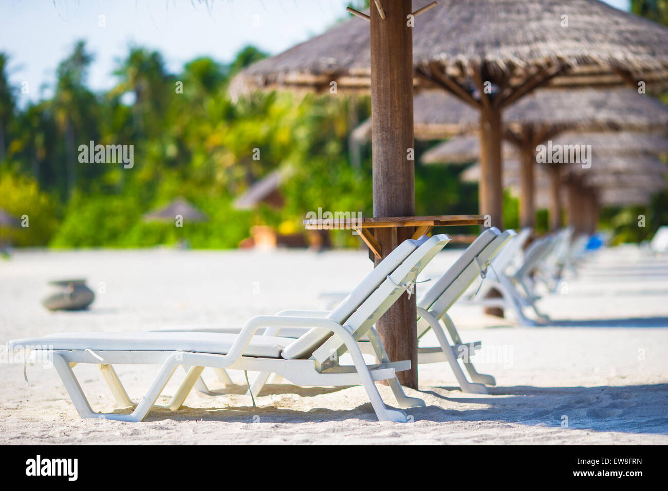 Beach wooden chairs for vacations on tropical beach Stock Photo - Alamy