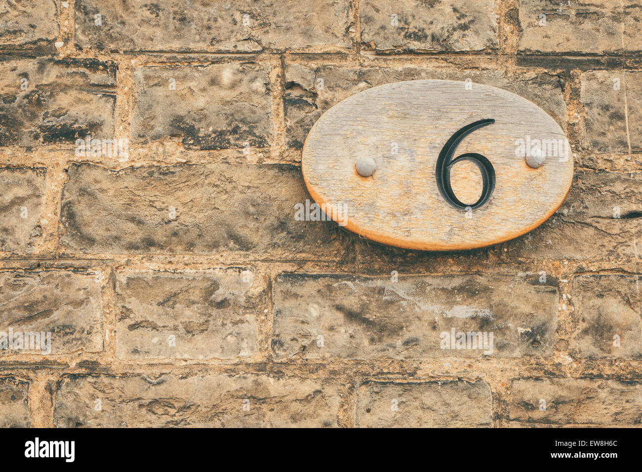 Wooden plate number 6 six on brick wall conceptual image closeup Stock ...