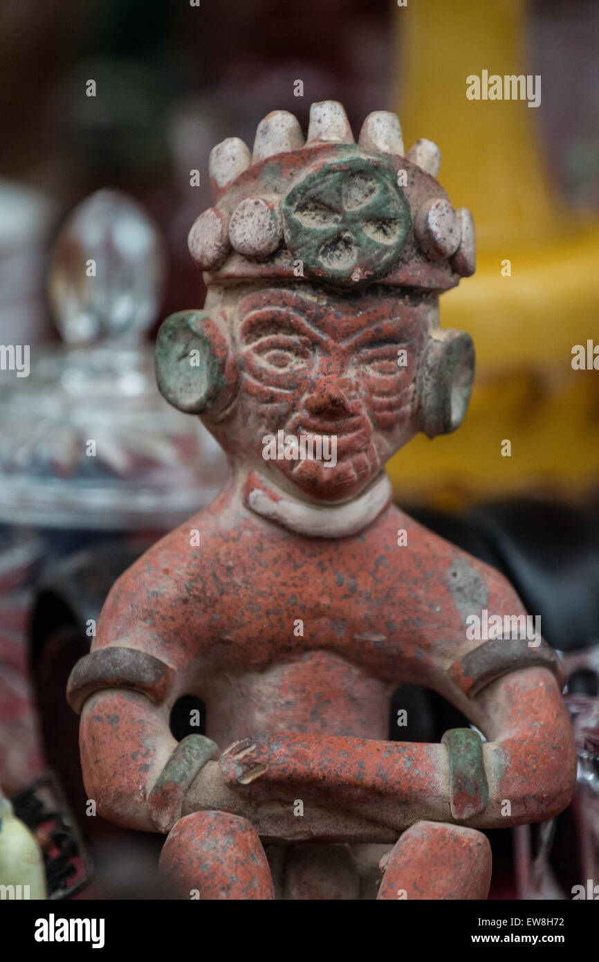 Close up view of a small red Maya statue at sale in a market Stock ...