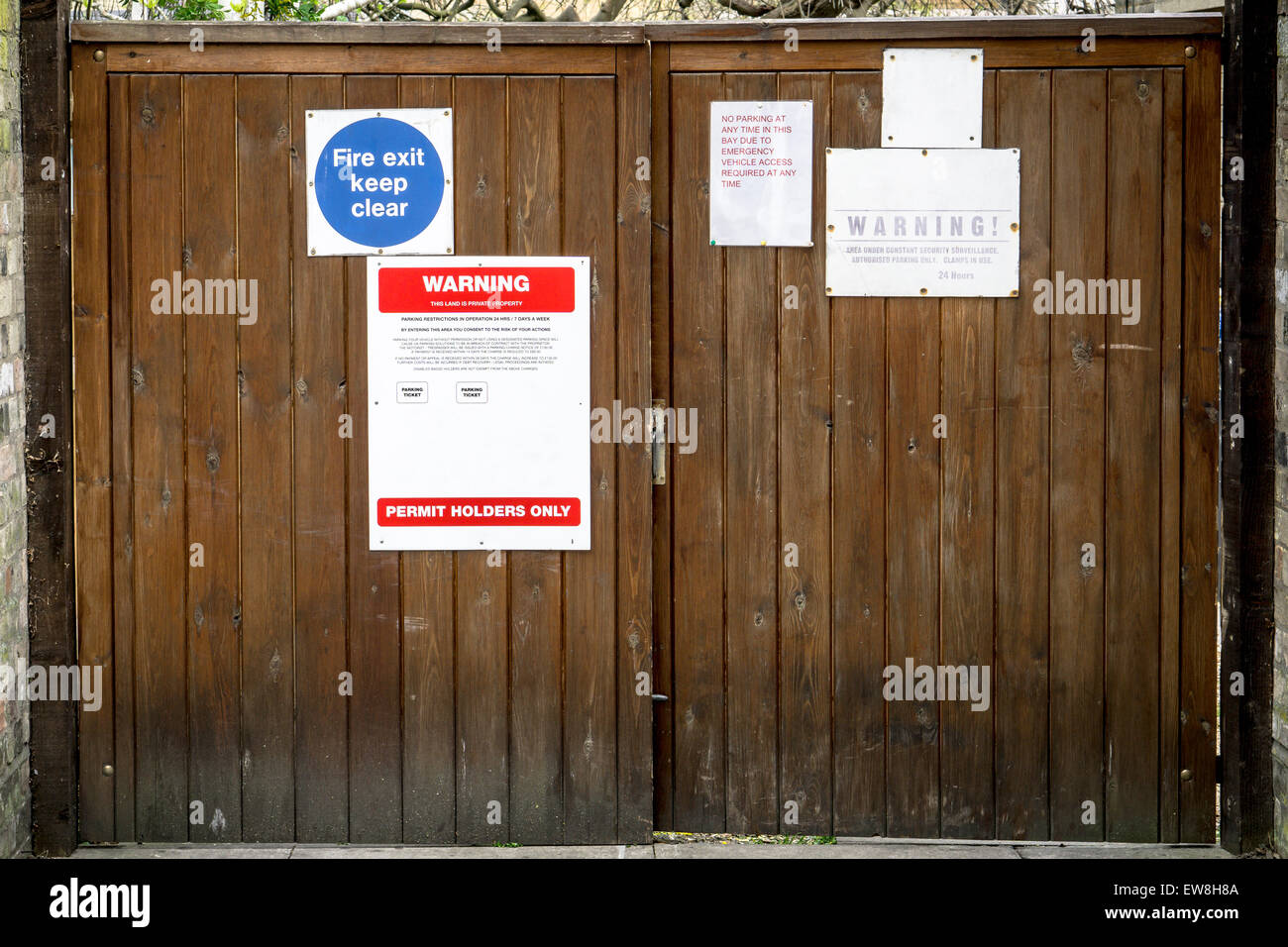 Conceptual image of Warning sign for Fire Exit, No Parking, CCTV on a ...