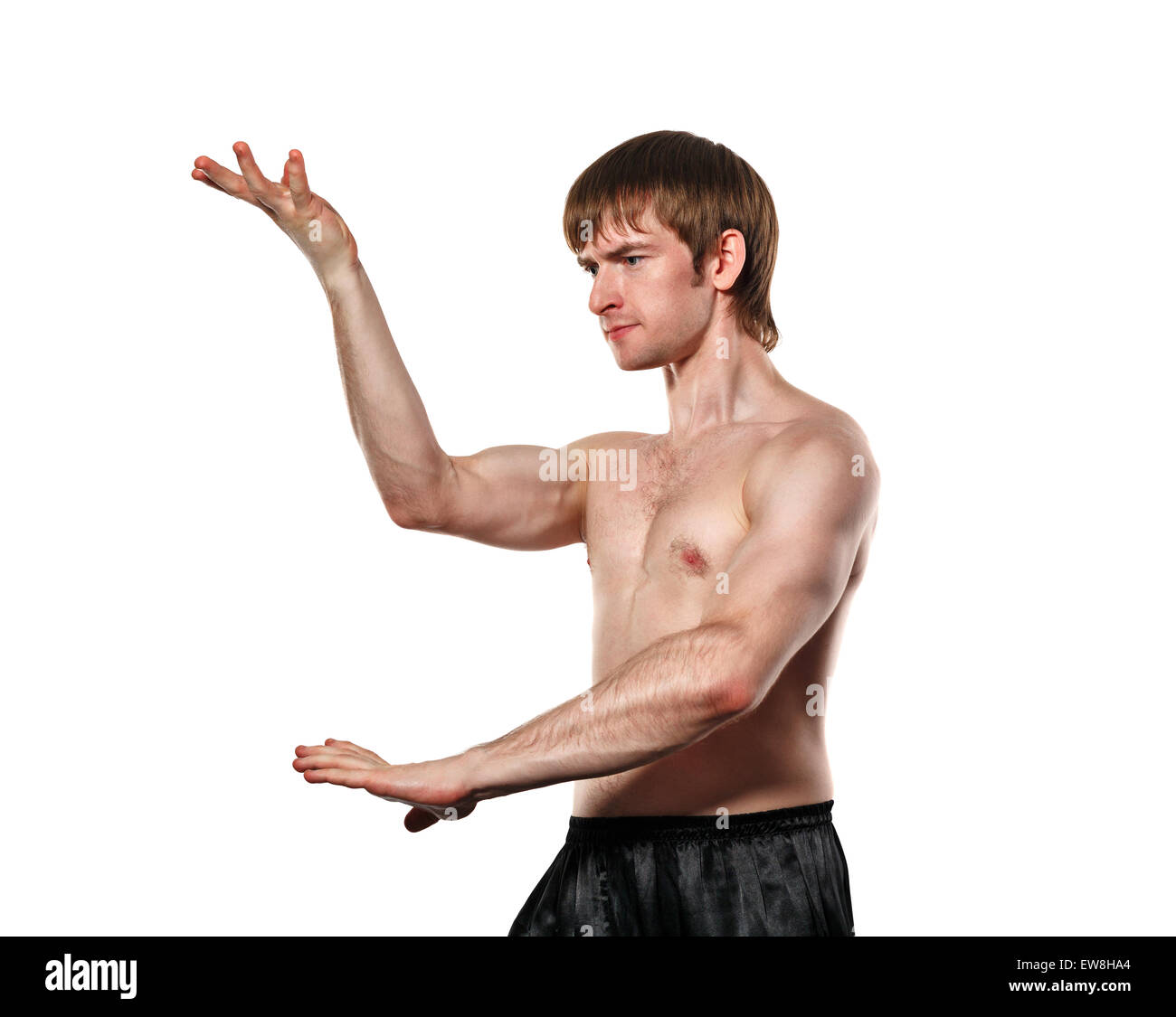 The man trains kata kung fu. Isolated on white background. Healthy ...