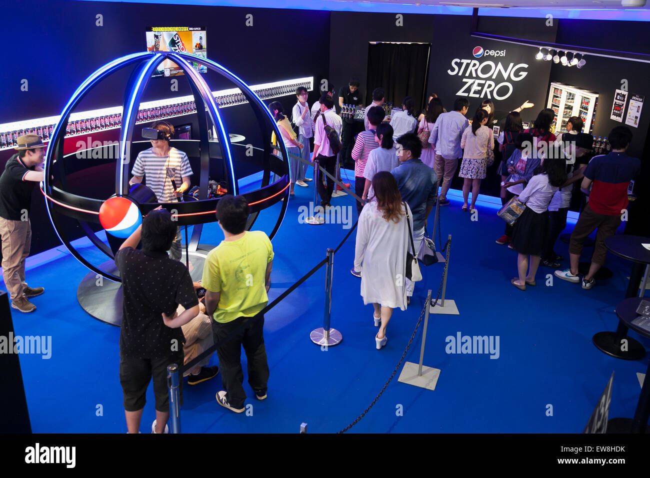 People line up at the ''Pepsi Strong Bar'' in Omotesando on June 20 ...