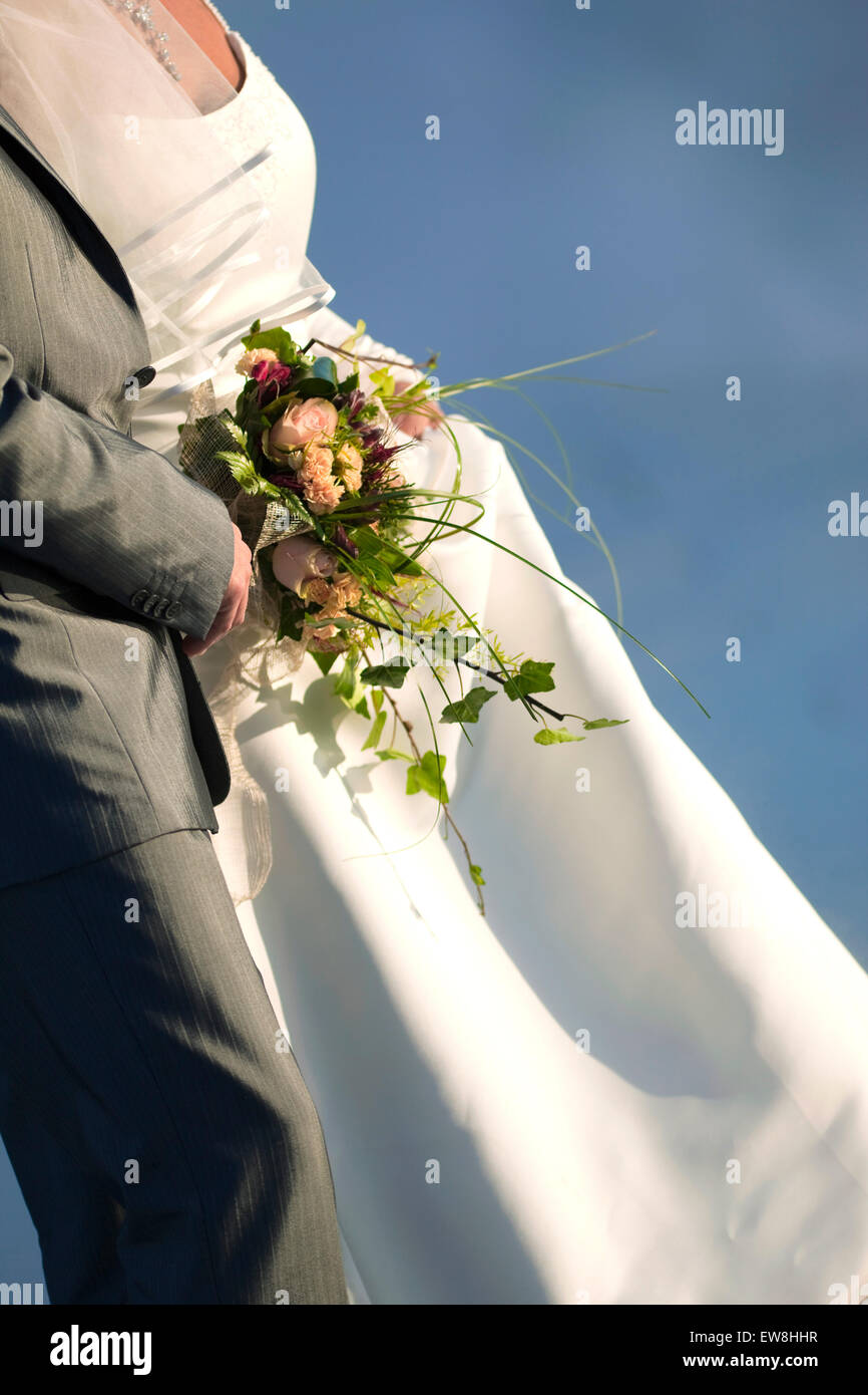 Young married couple and bouquet of flowers Stock Photo - Alamy