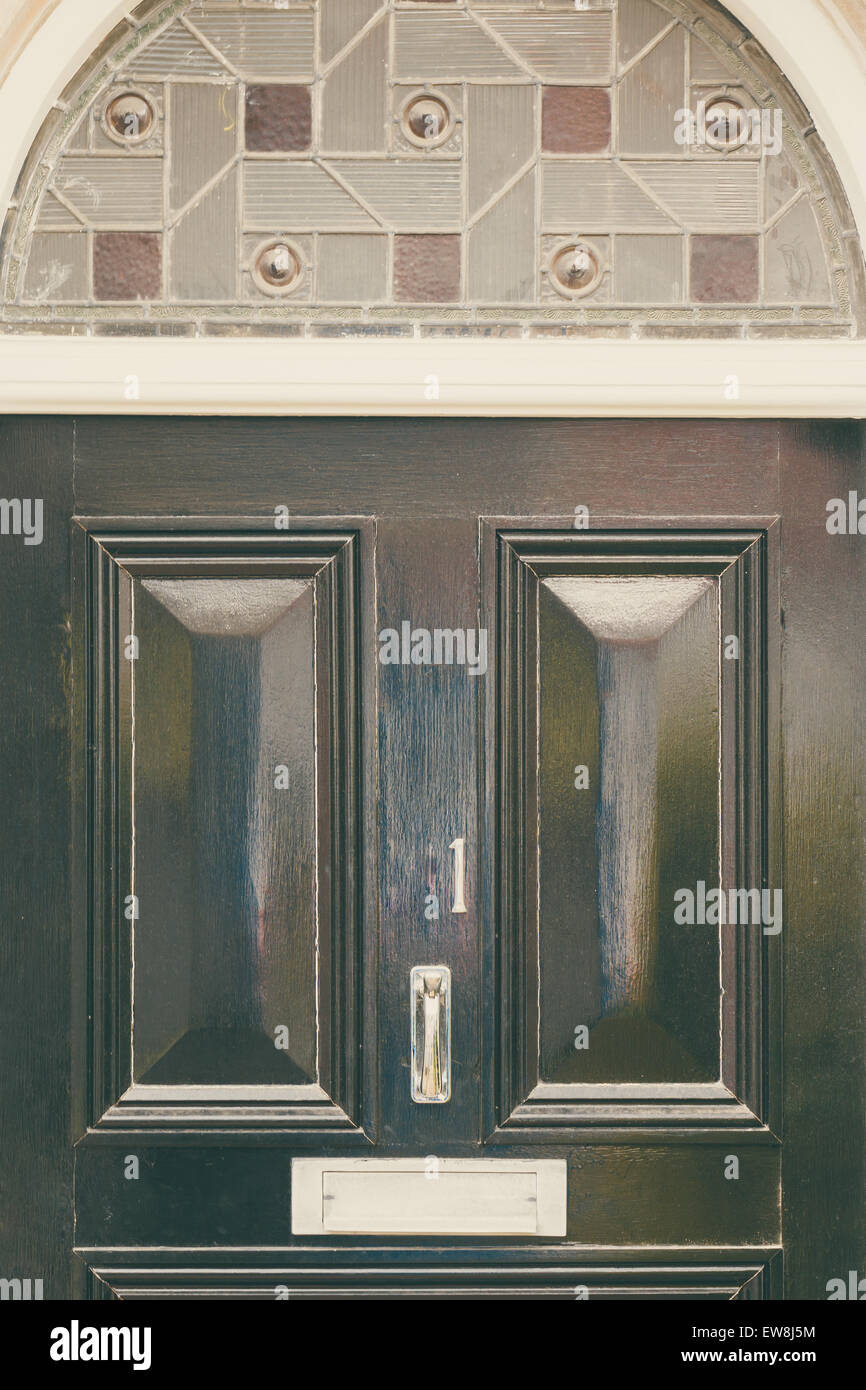 Door number 1 one door knocker and letterbox conceptual image closeup ...