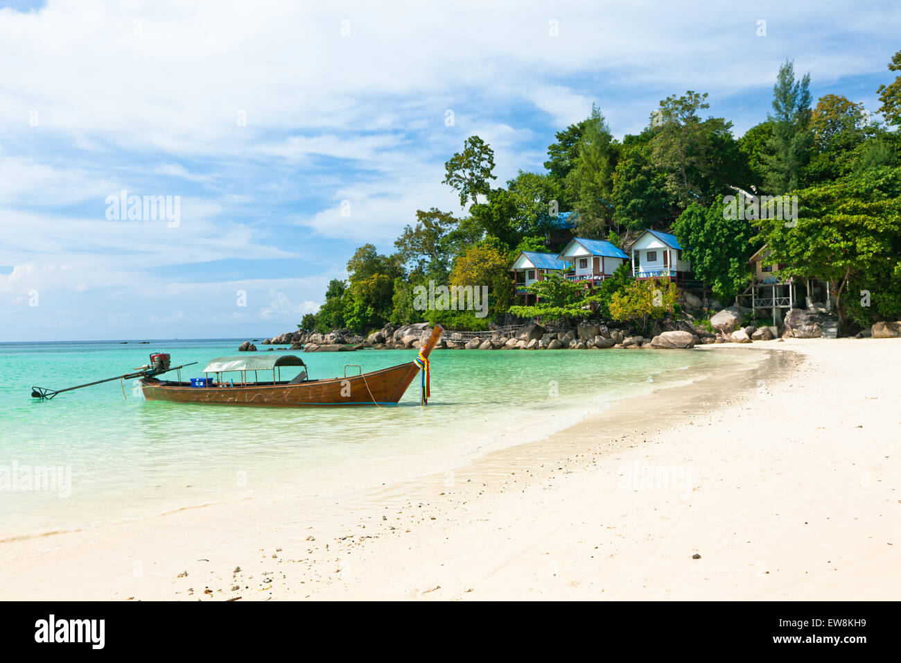 Boat and bungalows on the beach of Koh Lipe Island, Thailand Stock ...