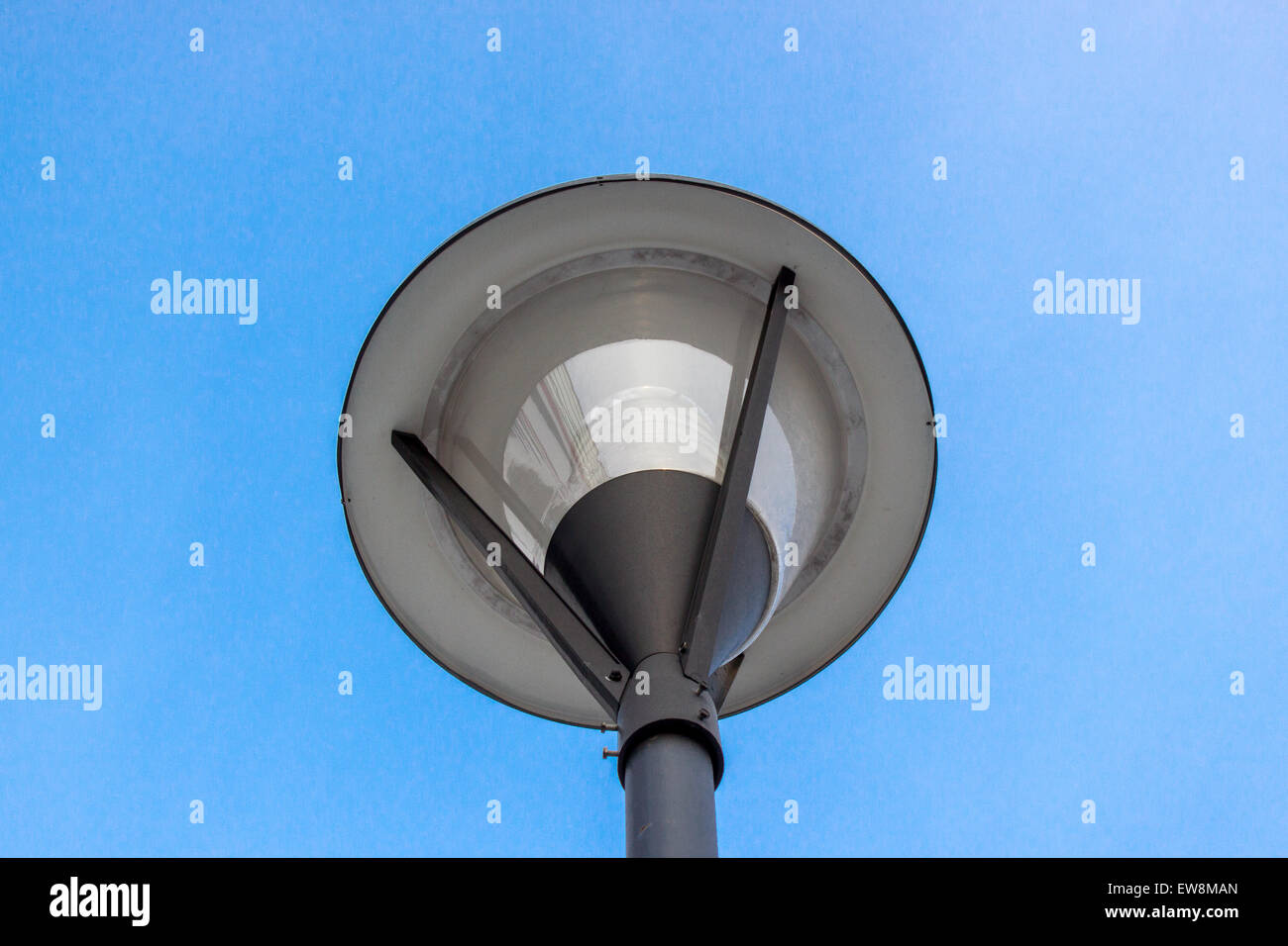 Street light with halogen lamp against blue sky Stock Photo - Alamy