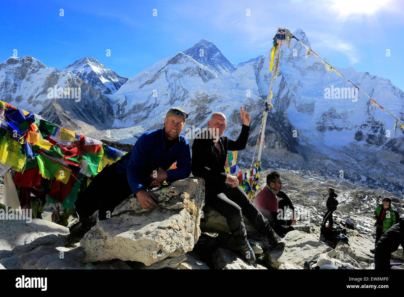 Group of trekkers walking in snowy mountains hi-res stock photography ...