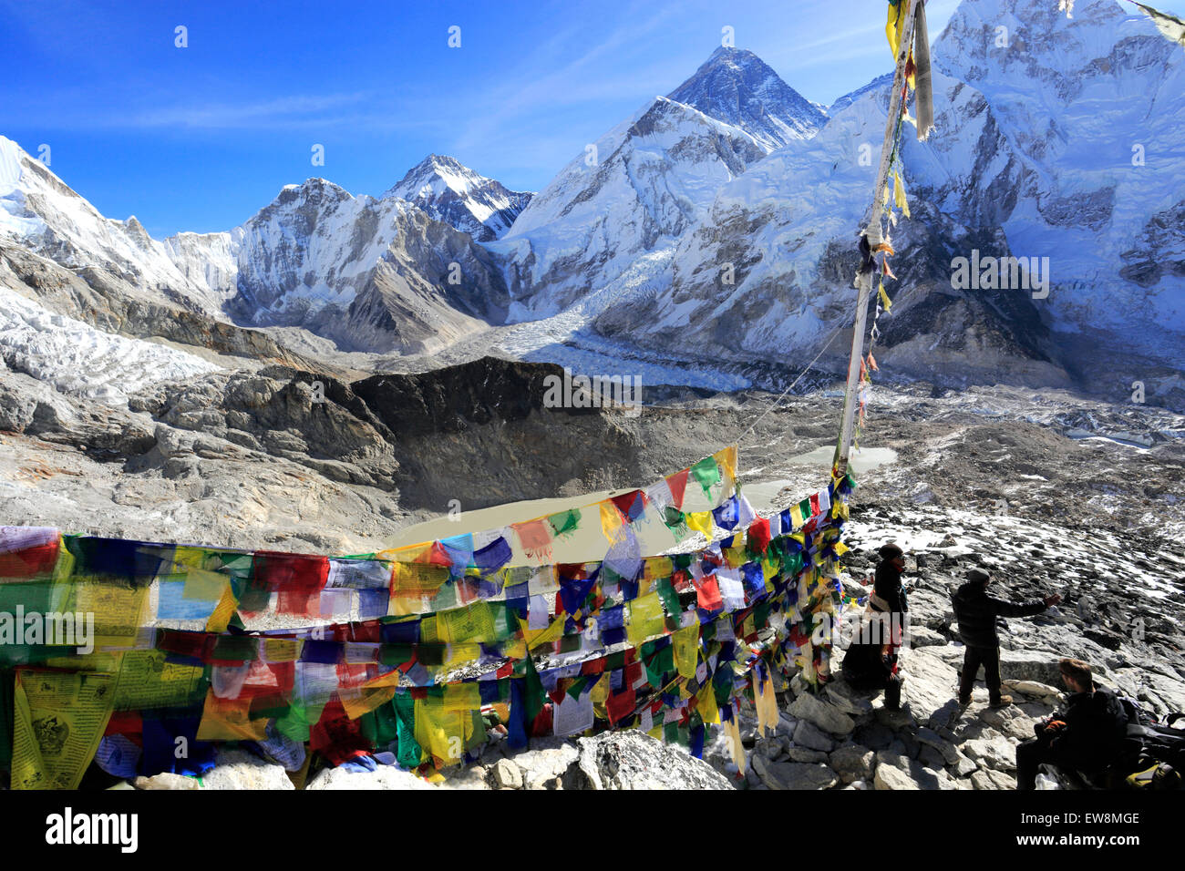 Group of trekkers walking in snowy mountains hi-res stock photography ...