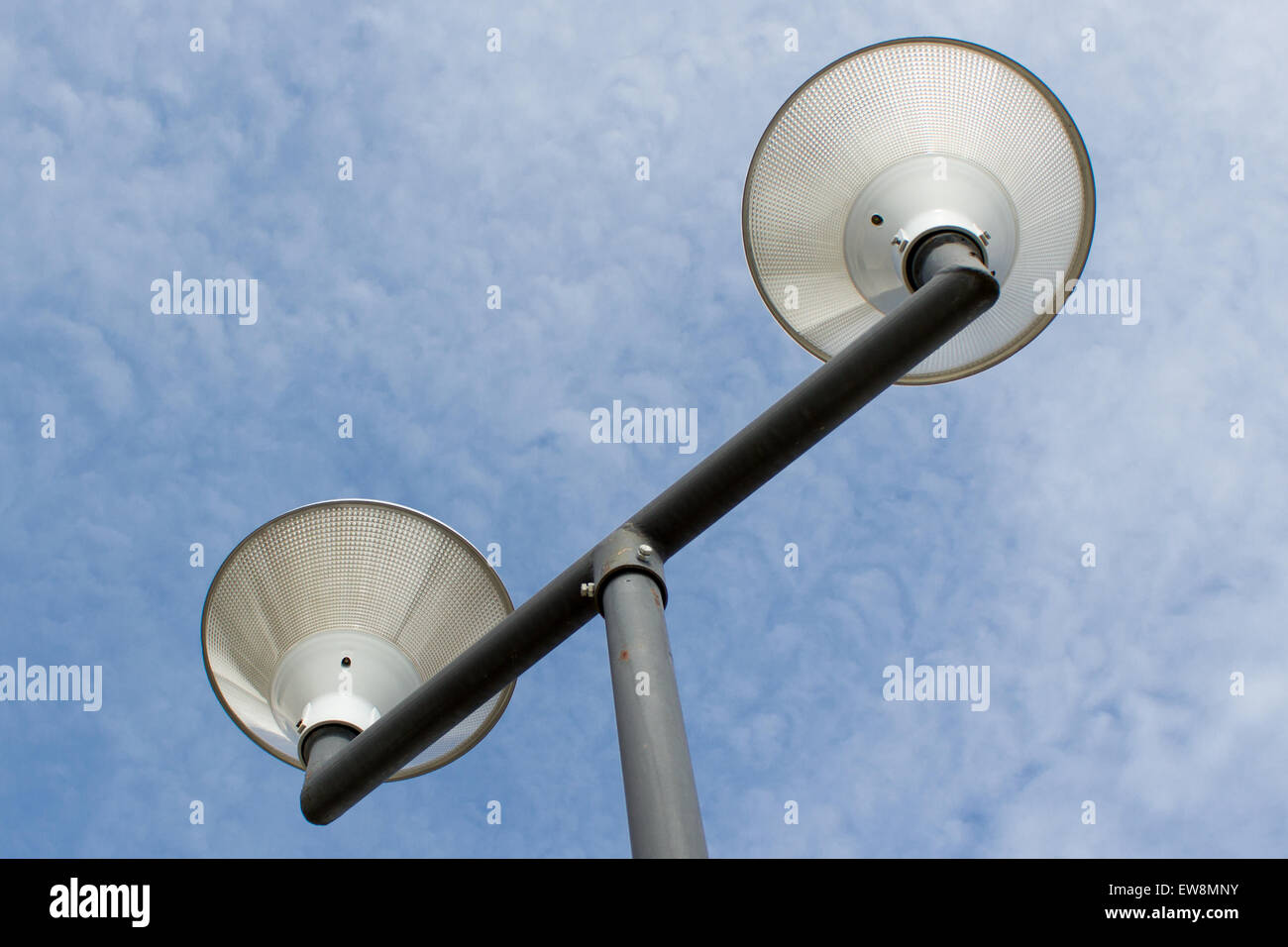 Street light with halogen lamp against blue sky Stock Photo - Alamy