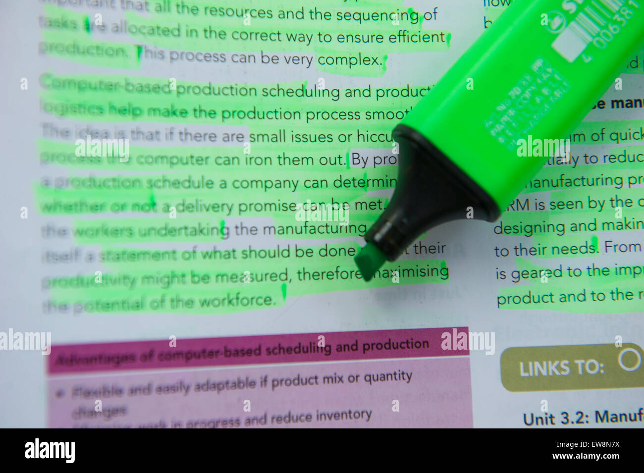 Highlighter pens on A level homework and revision Stock Photo - Alamy