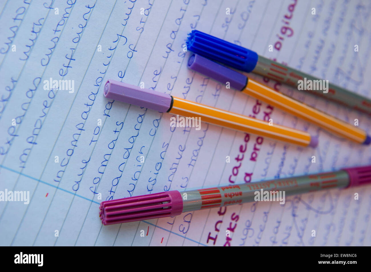Highlighter pens on A level homework and revision Stock Photo - Alamy