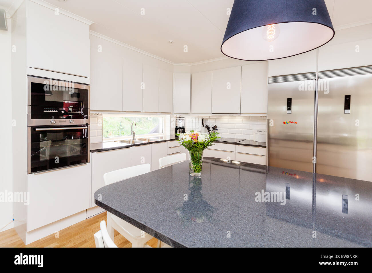fancy kitchen interior with marble kitchen island Stock Photo - Alamy