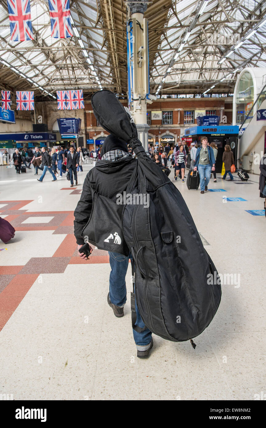 Man carrying double bass musical instrument hi-res stock photography ...