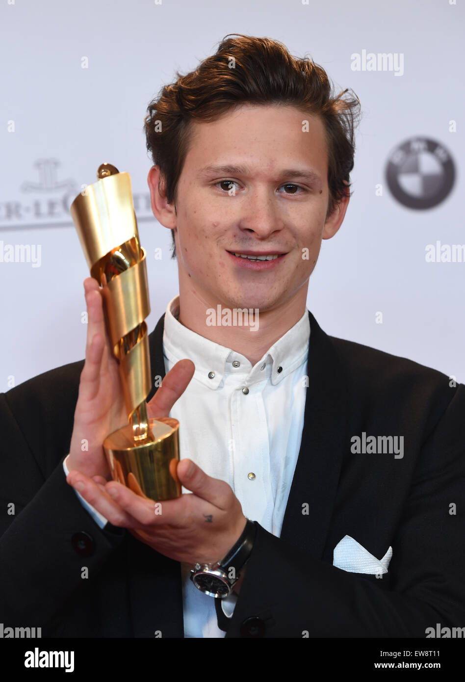 Berlin, Germany. 19th June, 2015. Swiss actor Joel Basman with his ...