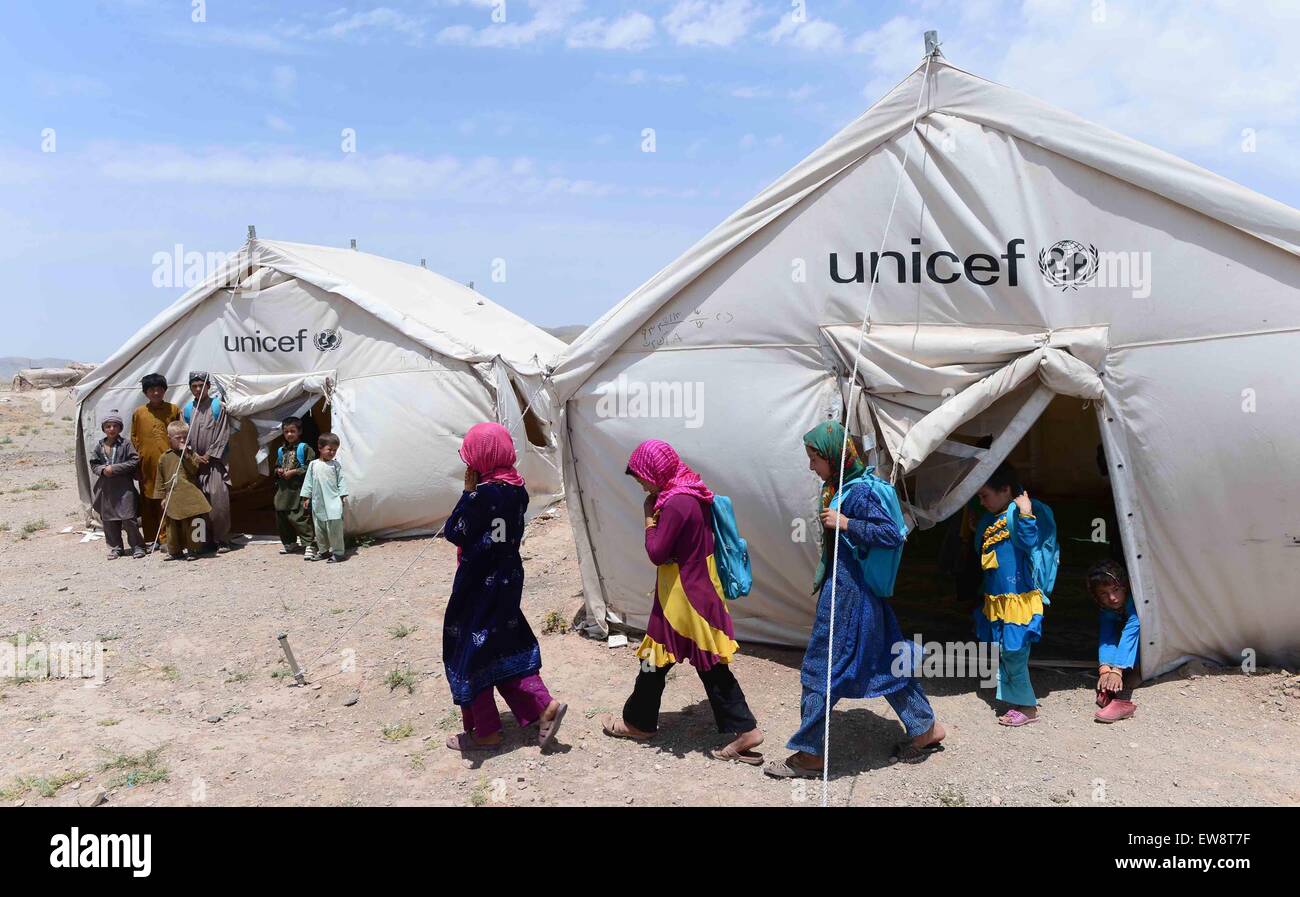 Herat, Afghanistan. 20th June, 2015. Afghan refugees walk outside their ...